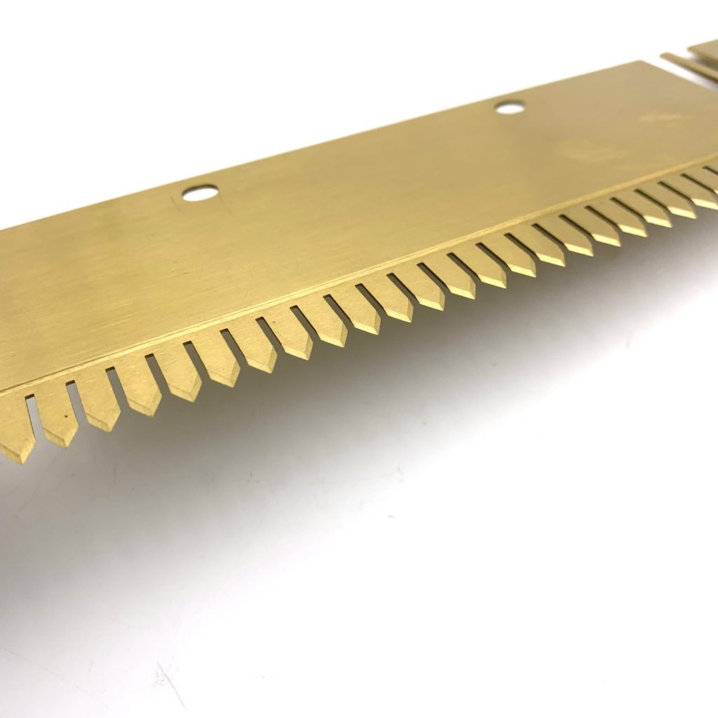 Tin coating serrated knives for packaging machinery
